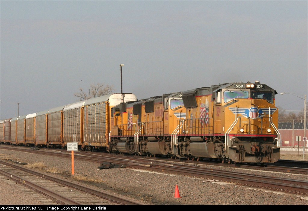 UP 5139 leads Autoracks EB past Pawnee rd @ 09:58